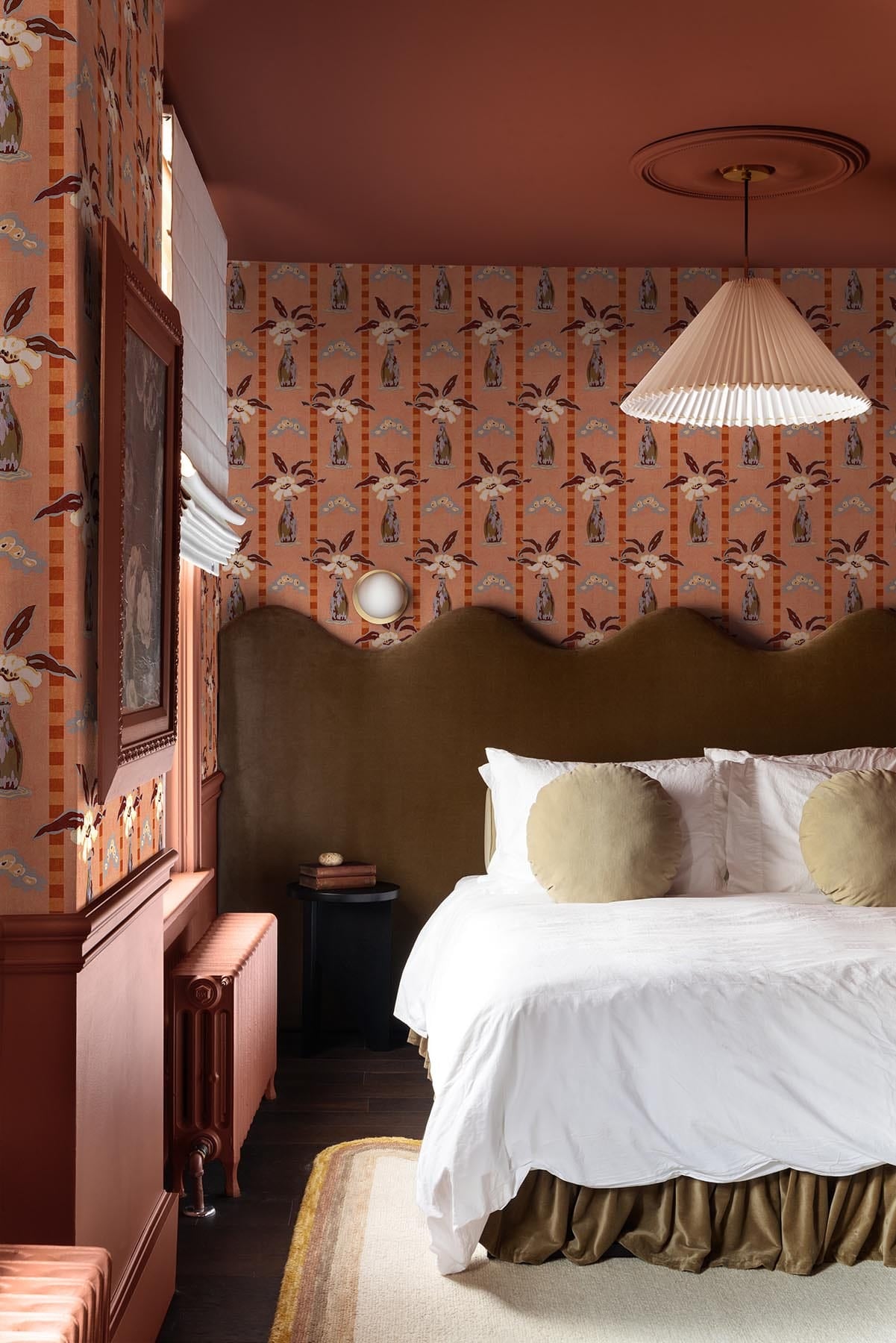 Terracotta colored wall mural with geometric and botanical design ...